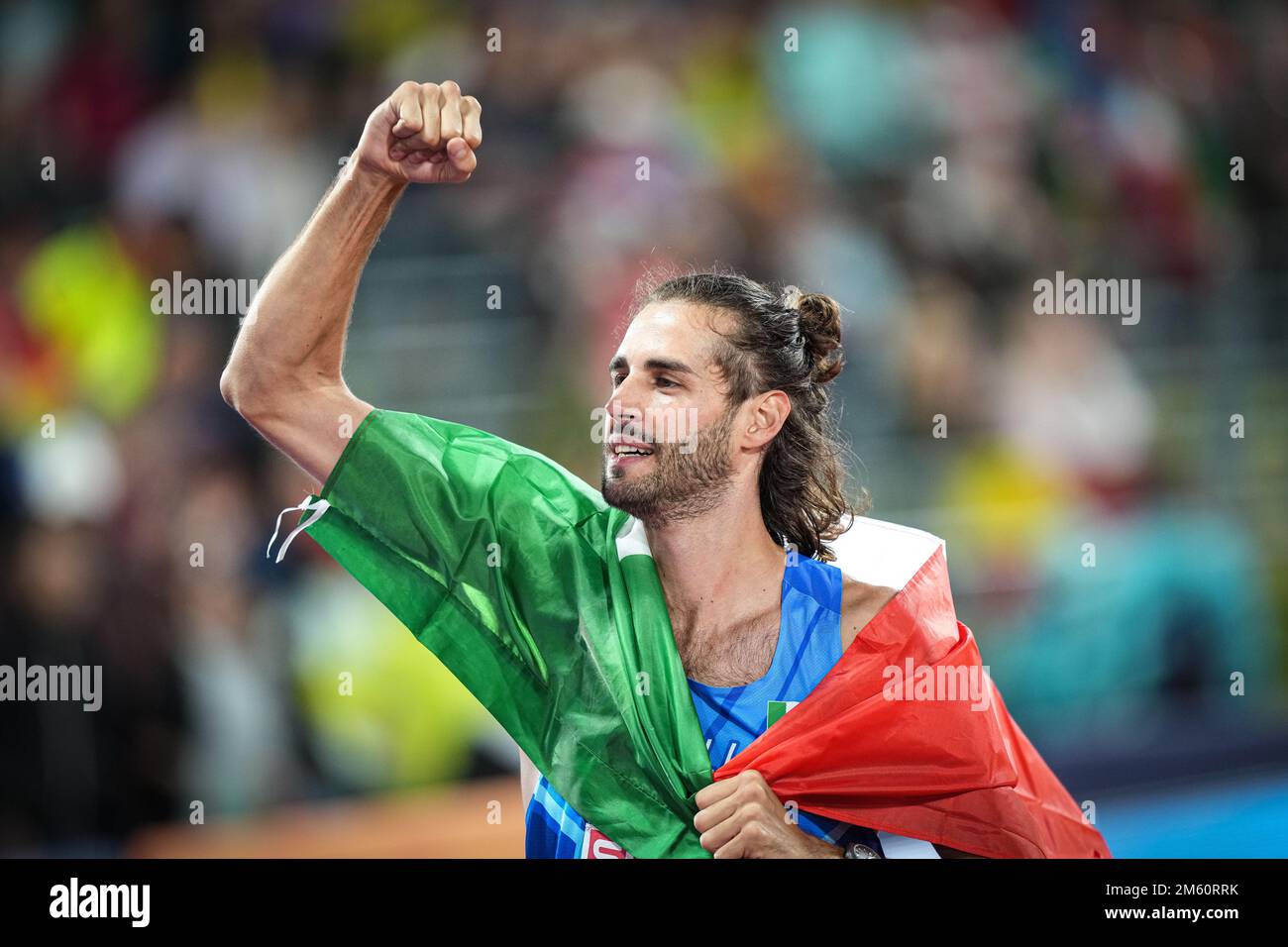 Gianmarco Tamberi with his country's flag after winning the high jump ...