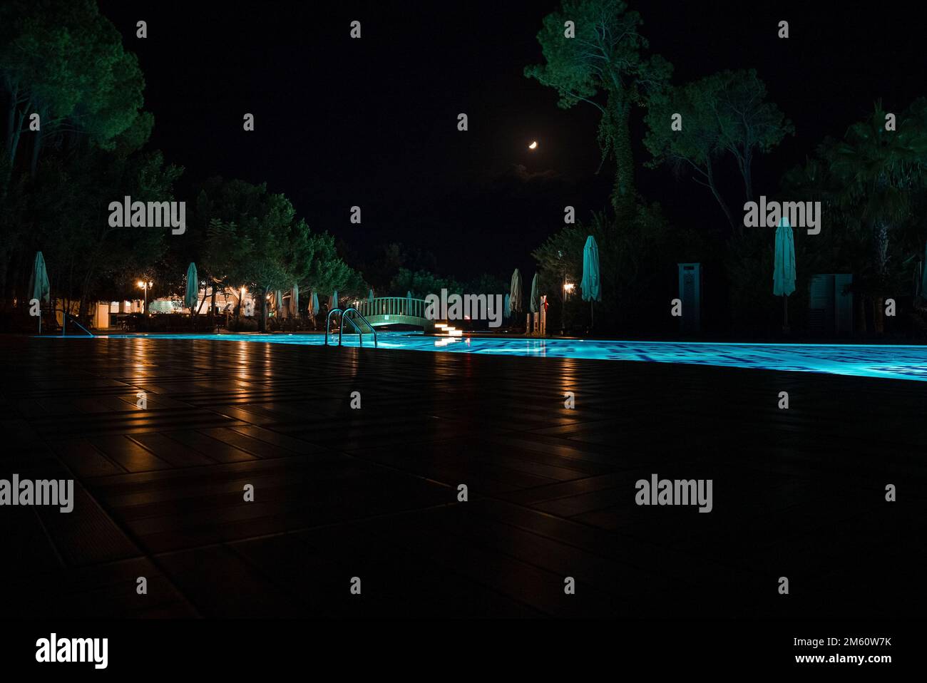 View of illuminated swimming pool at night in tourist resort Stock ...