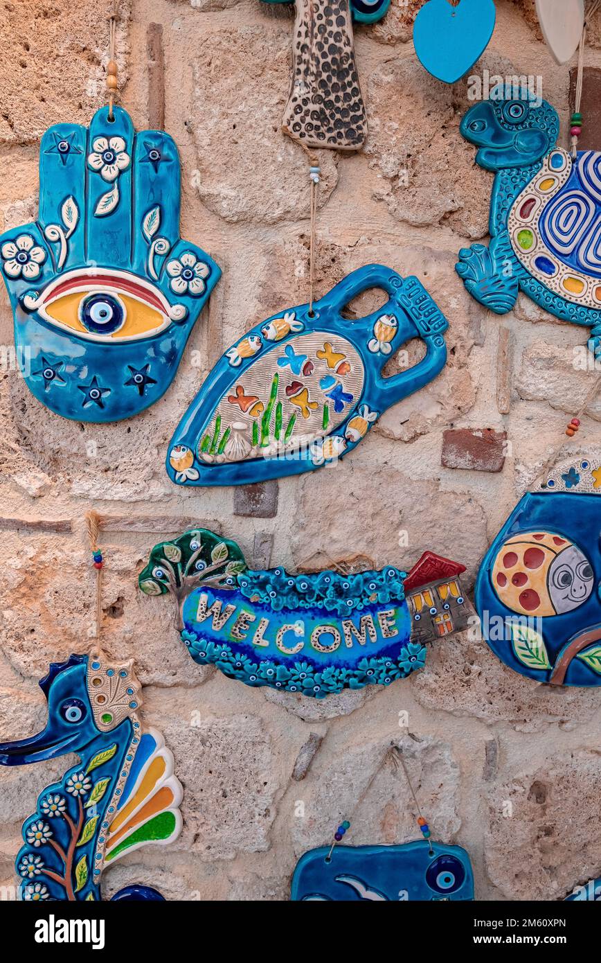 Blue magnet souvenirs displayed on wall for sale at shop Stock Photo ...