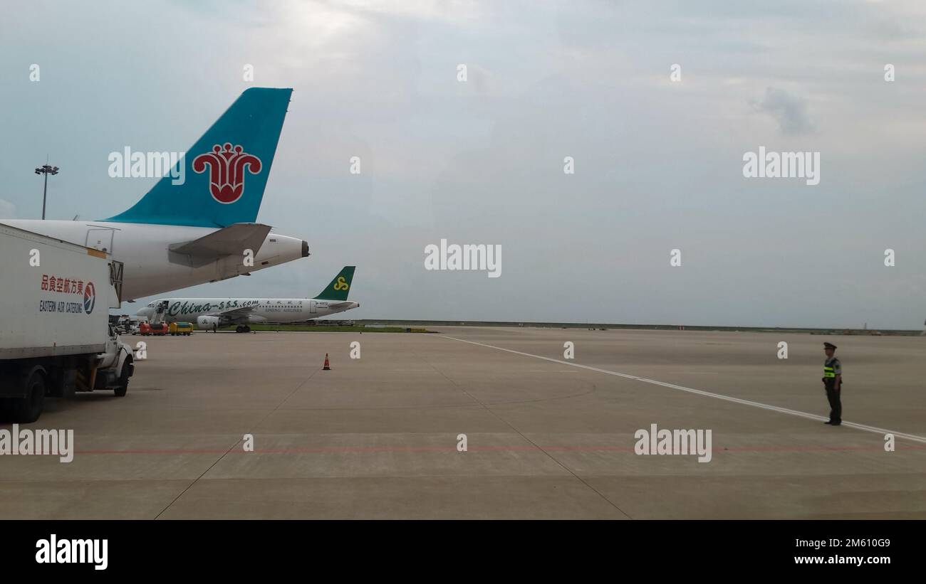 security guard of airport is standing and watching planes Stock Photo ...