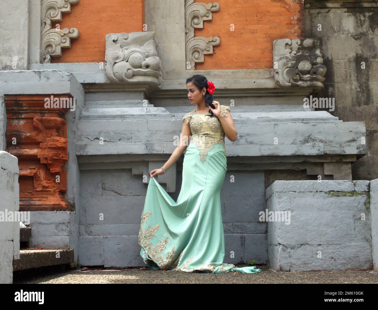 portrait of a Balinese woman wearing traditional Balinese fashion with ...