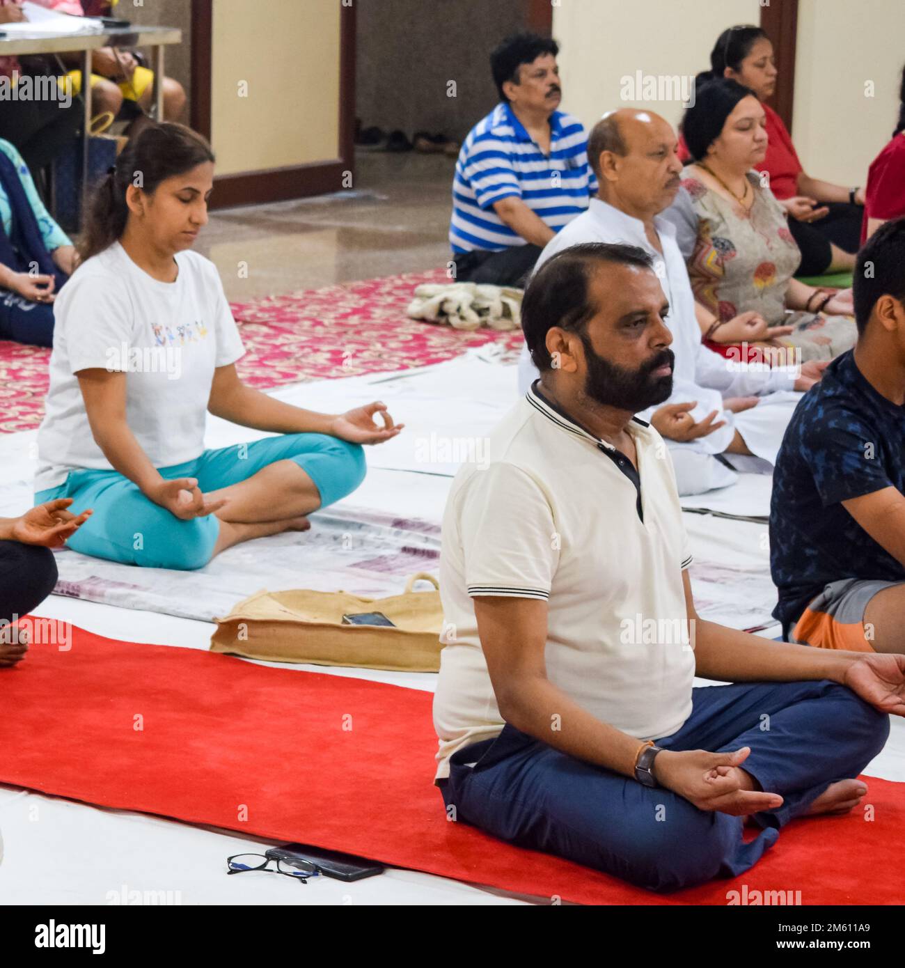 New Delhi, India, June 19 2022 -Group Yoga exercise session for people ...