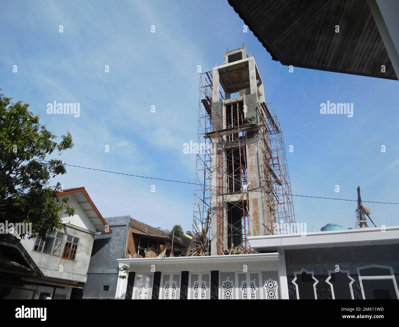 Construction on sky blue Stock Photo - Alamy