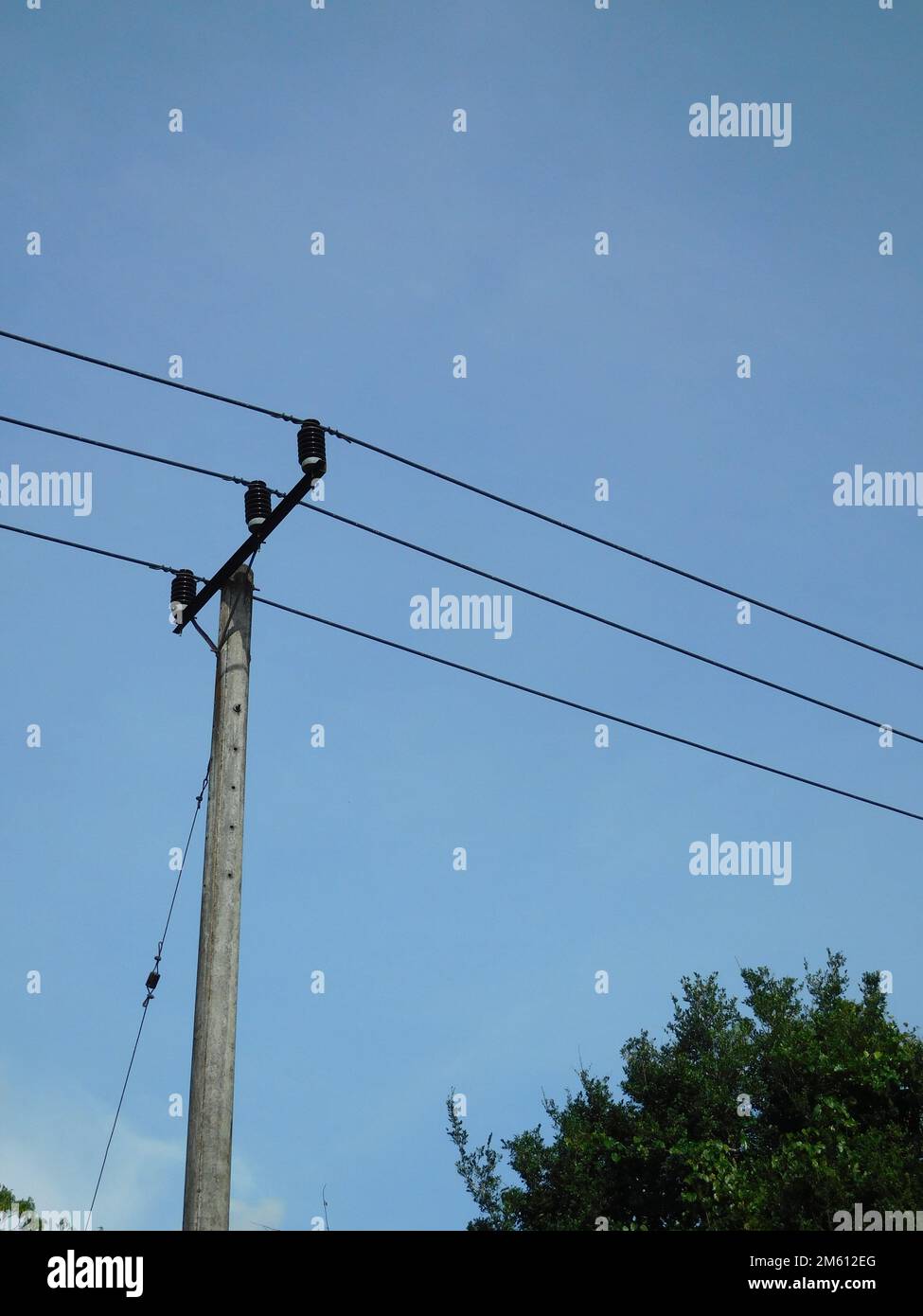 Power cord against the backround of blue sky Stock Photo - Alamy