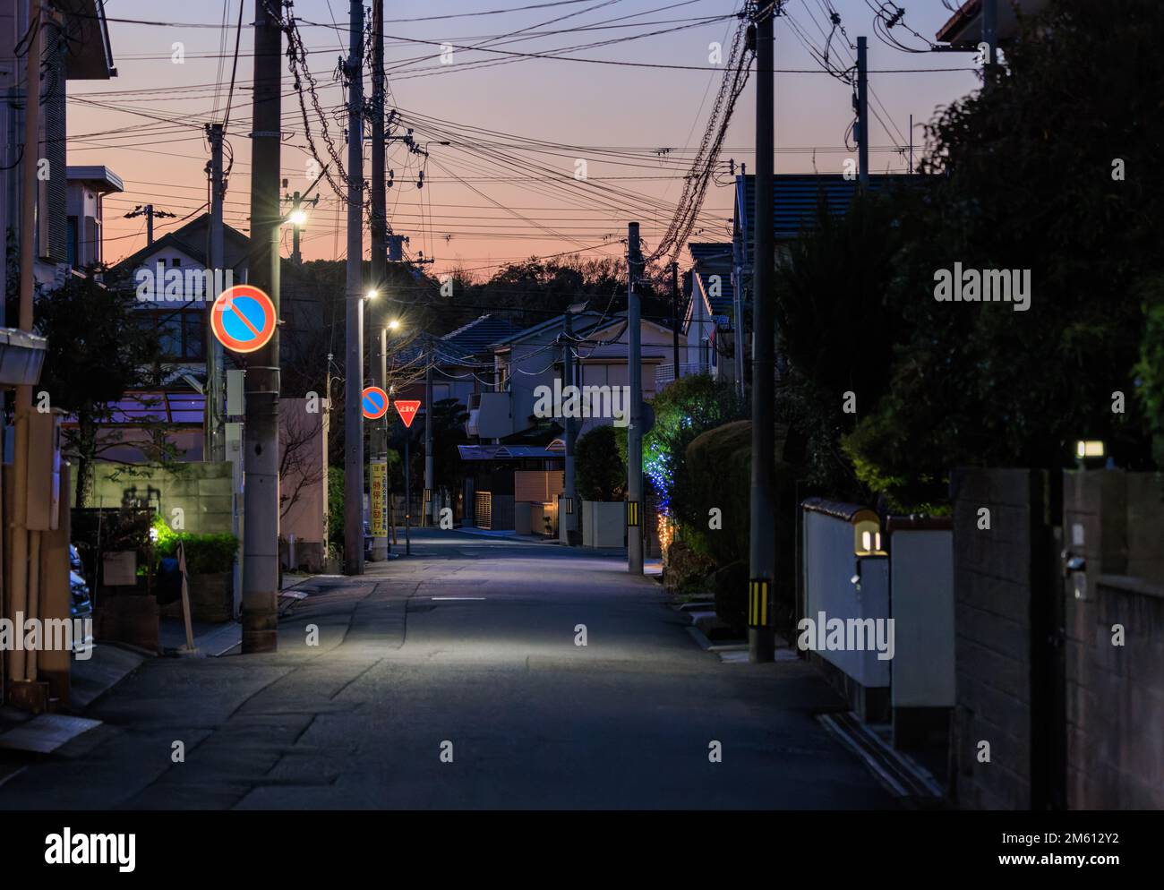 Quiet street in residential neighborhood with sunset color in sky Stock ...