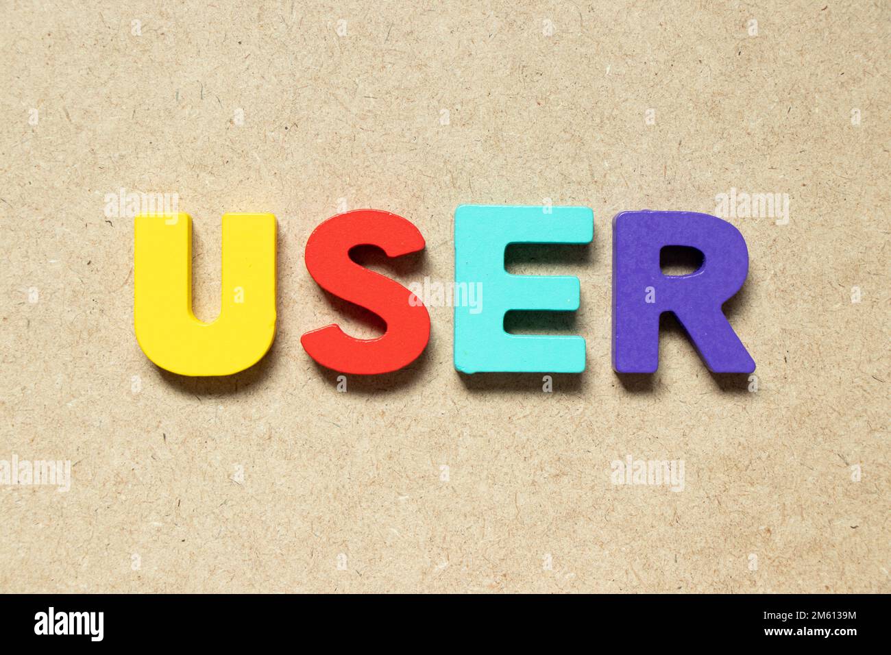 Color alphabet letter in word user on wood background Stock Photo - Alamy