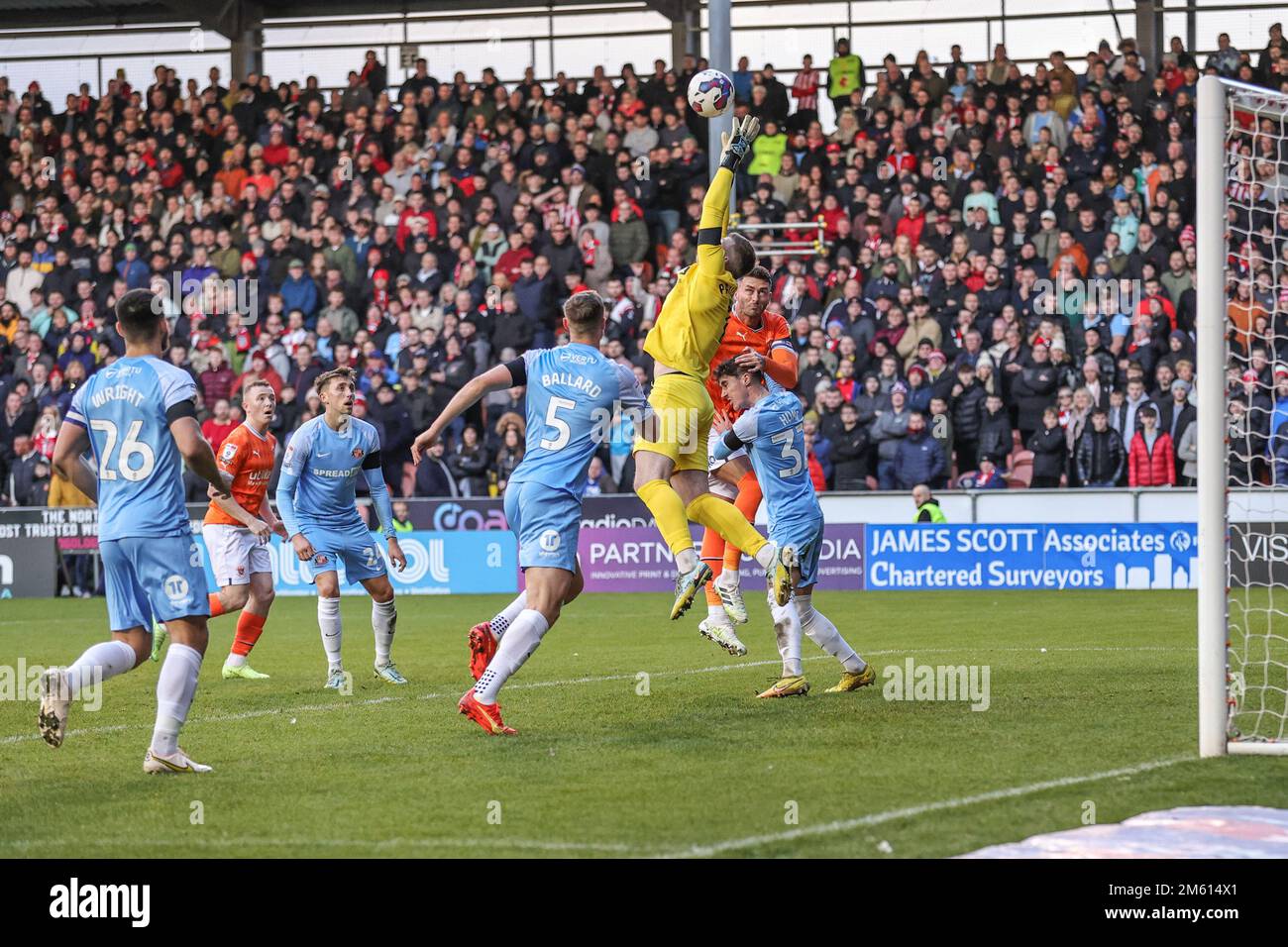 Gary Madine #14 of Blackpool challenges Anthony Patterson #1 of ...