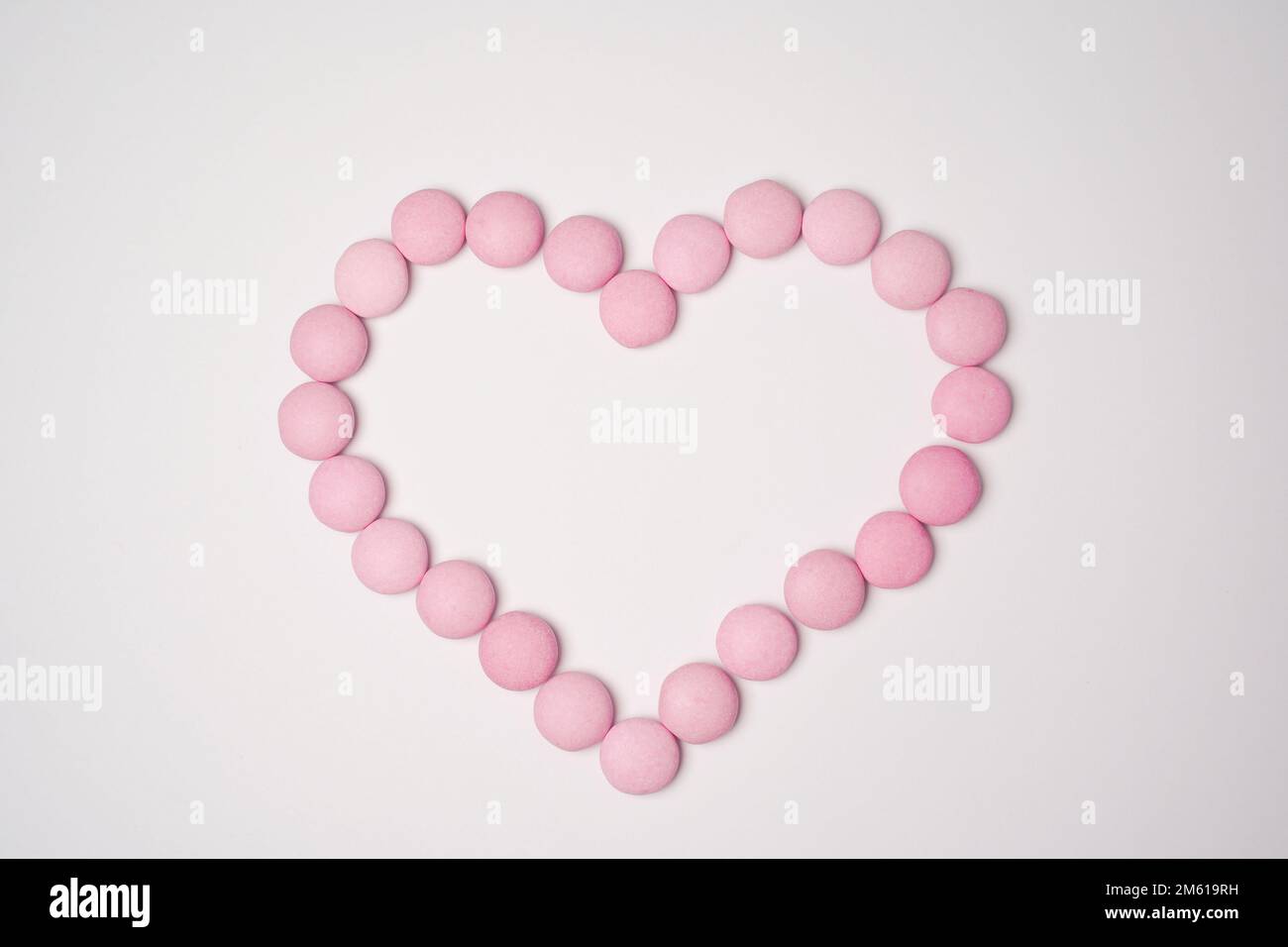 Sweets candies as heart on white background. Valentines day concept ...