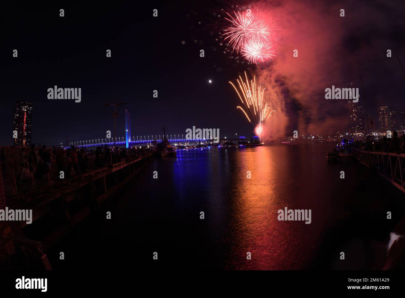 A large number of people watching fireworks at Dockland Marvel Stadium ...