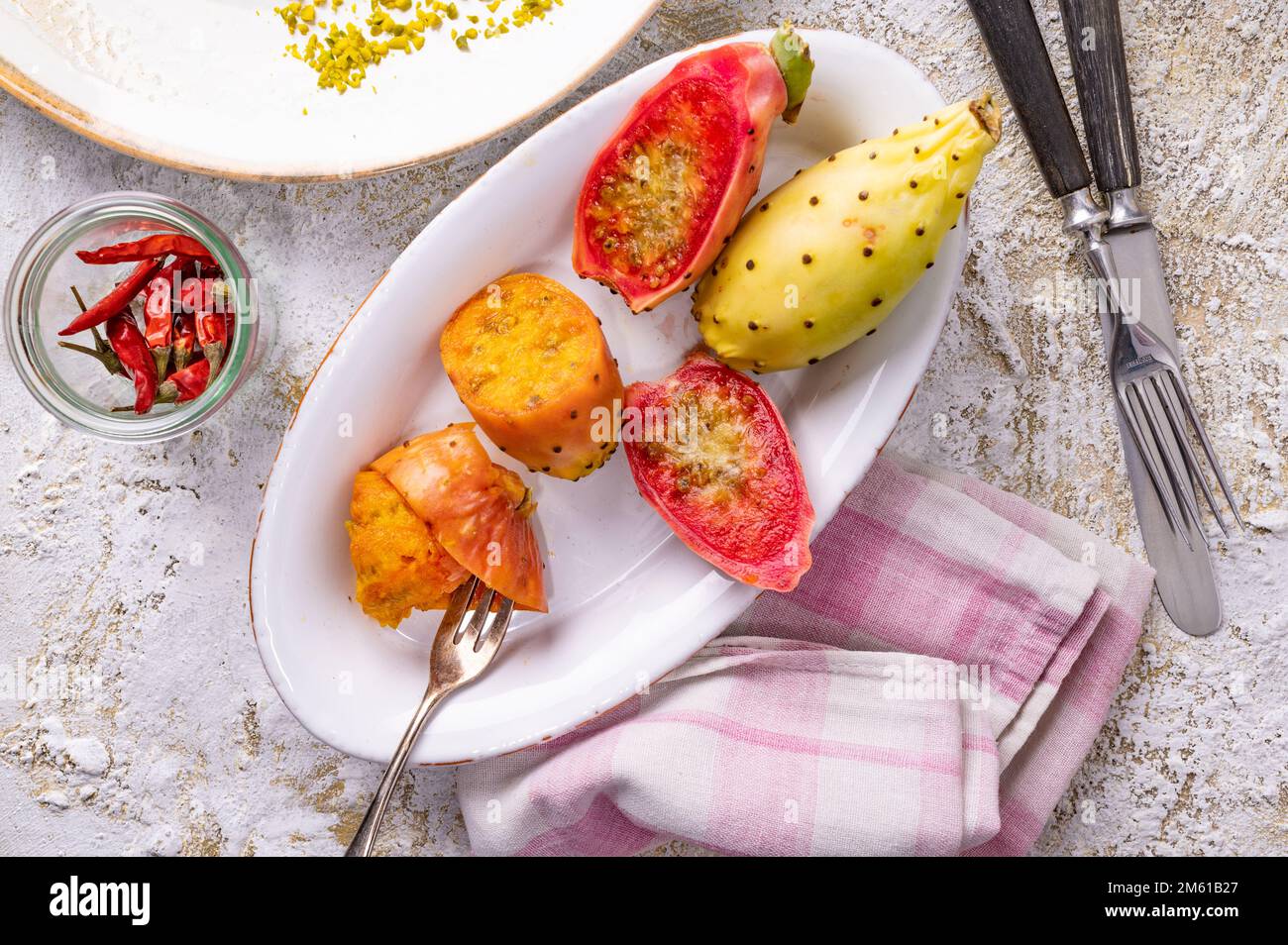 Colorful prickly pears on oval plate Stock Photo - Alamy