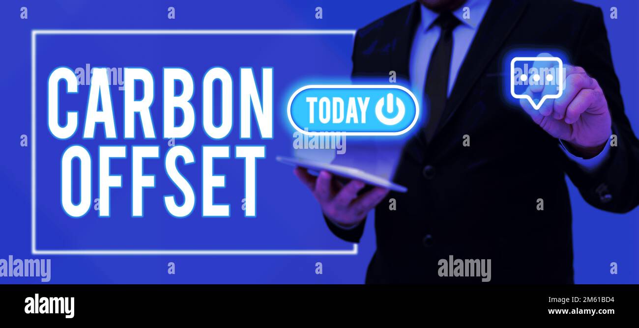 Hand writing sign Carbon Offset. Business showcase Reduction in ...