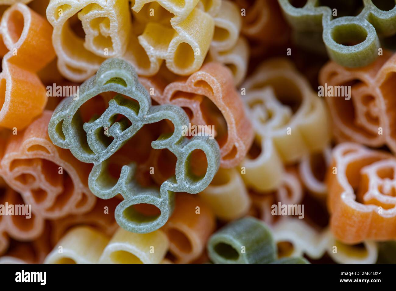 Closeup of Teddy Bear shapes colorful pasta background for design ...