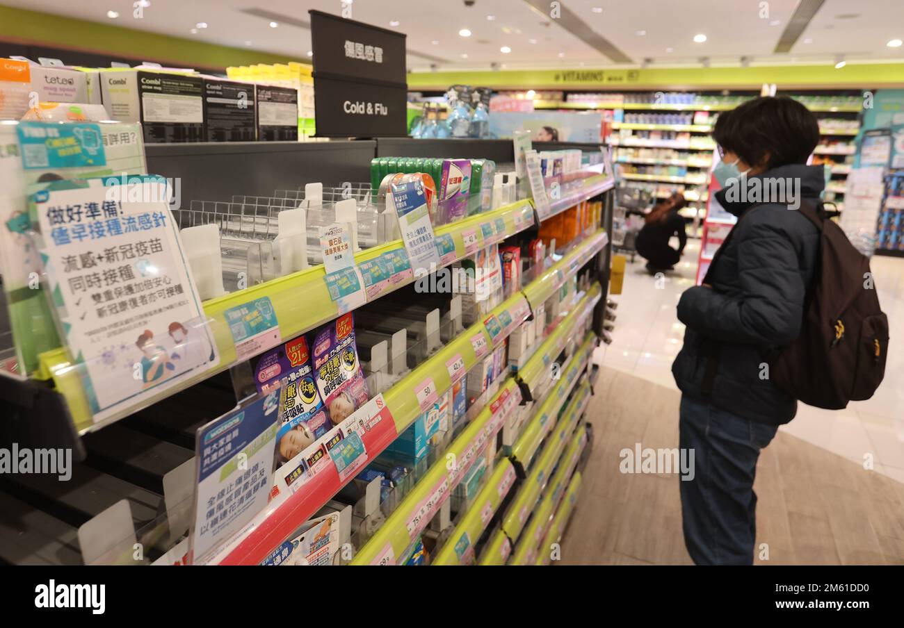 An empty shelf of cold medicine and panadol is seen at a shop in ...