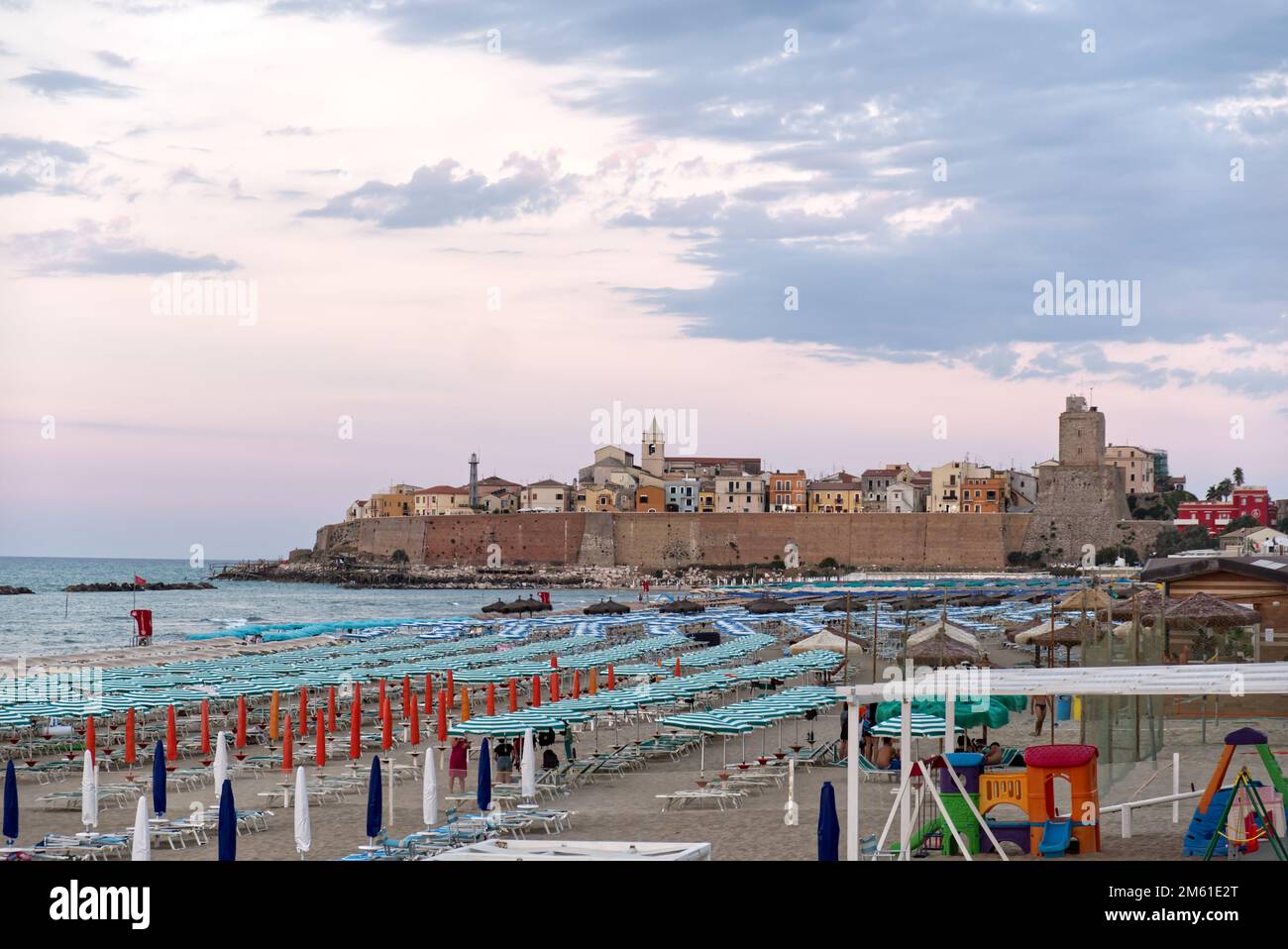 Panoramic view of the old town of Termoli with beach umbrellas and ...
