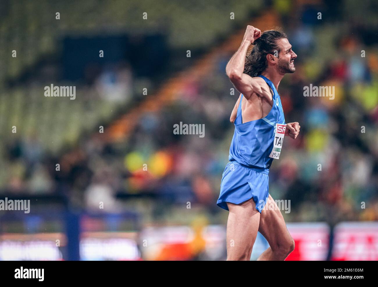 Gianmarco Tamberi participating in the high jump at the 2022 European ...