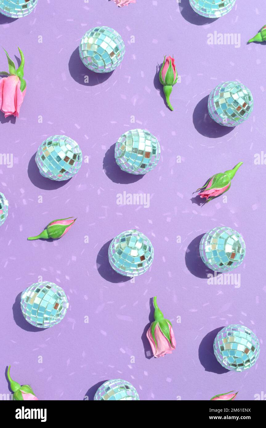 Pink roses flower and disco balls on a purple background. Retro ...