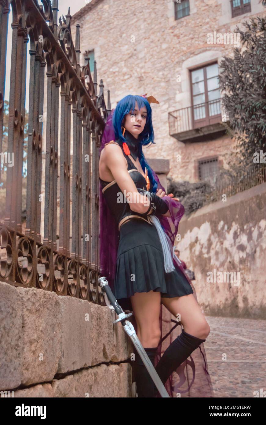 Young girls wearing a black bride like costume, warrior girl wielding a ...