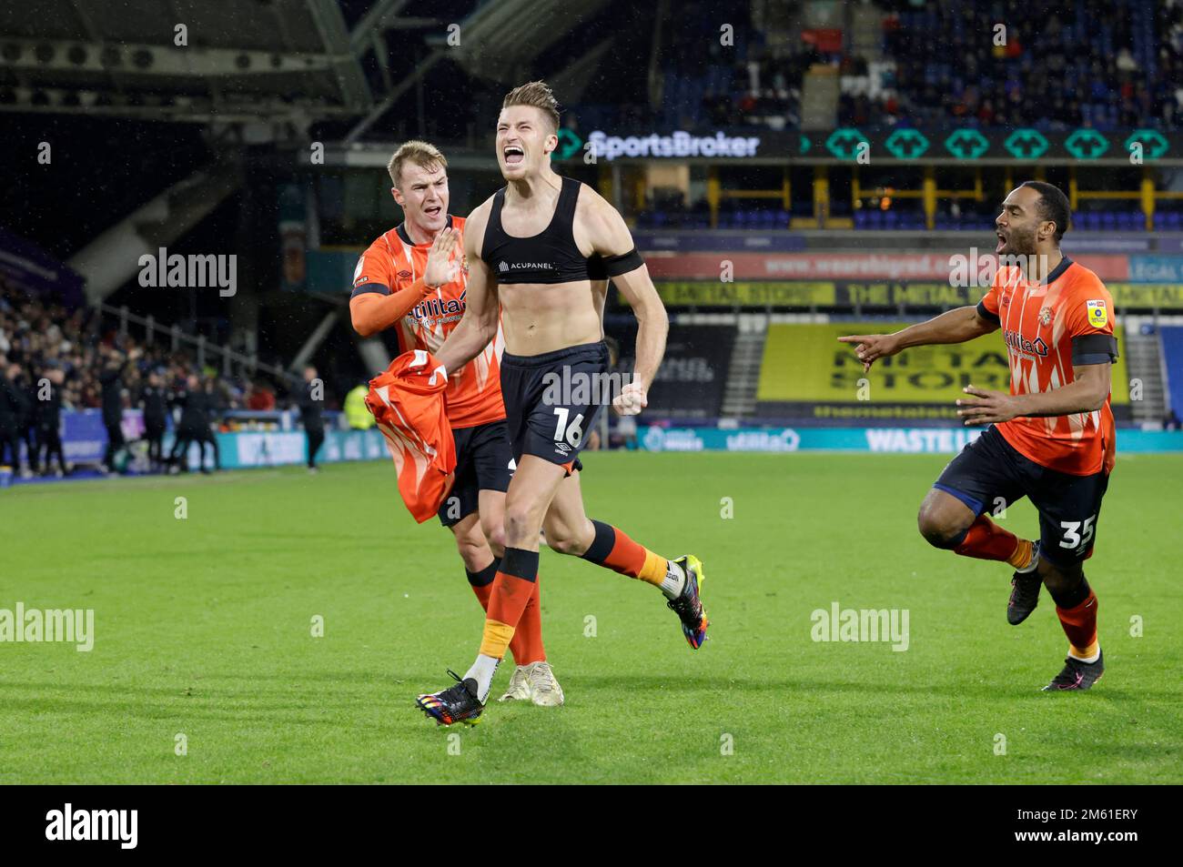Luton Town's Reece Burke (centre) celebrates scoring his sides second ...