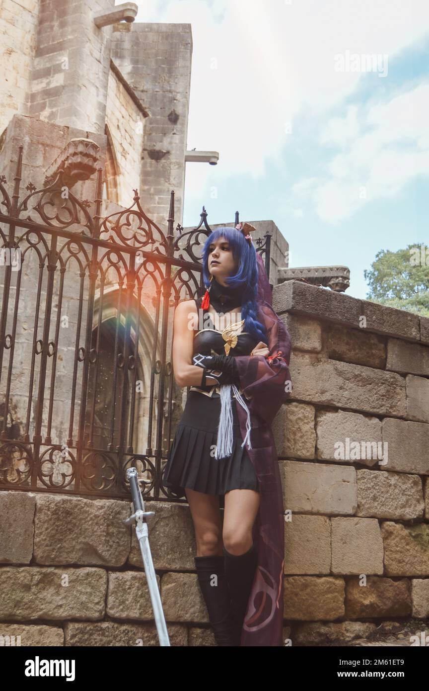 Young girls wearing a black bride like costume, warrior girl wielding a ...