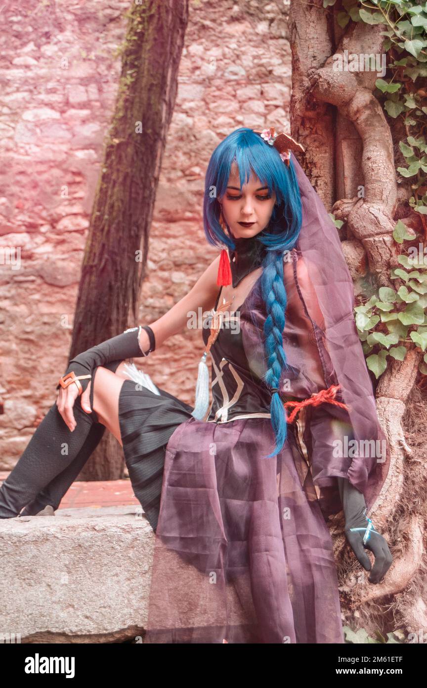 Young girls wearing a black bride like costume, warrior girl wielding a ...