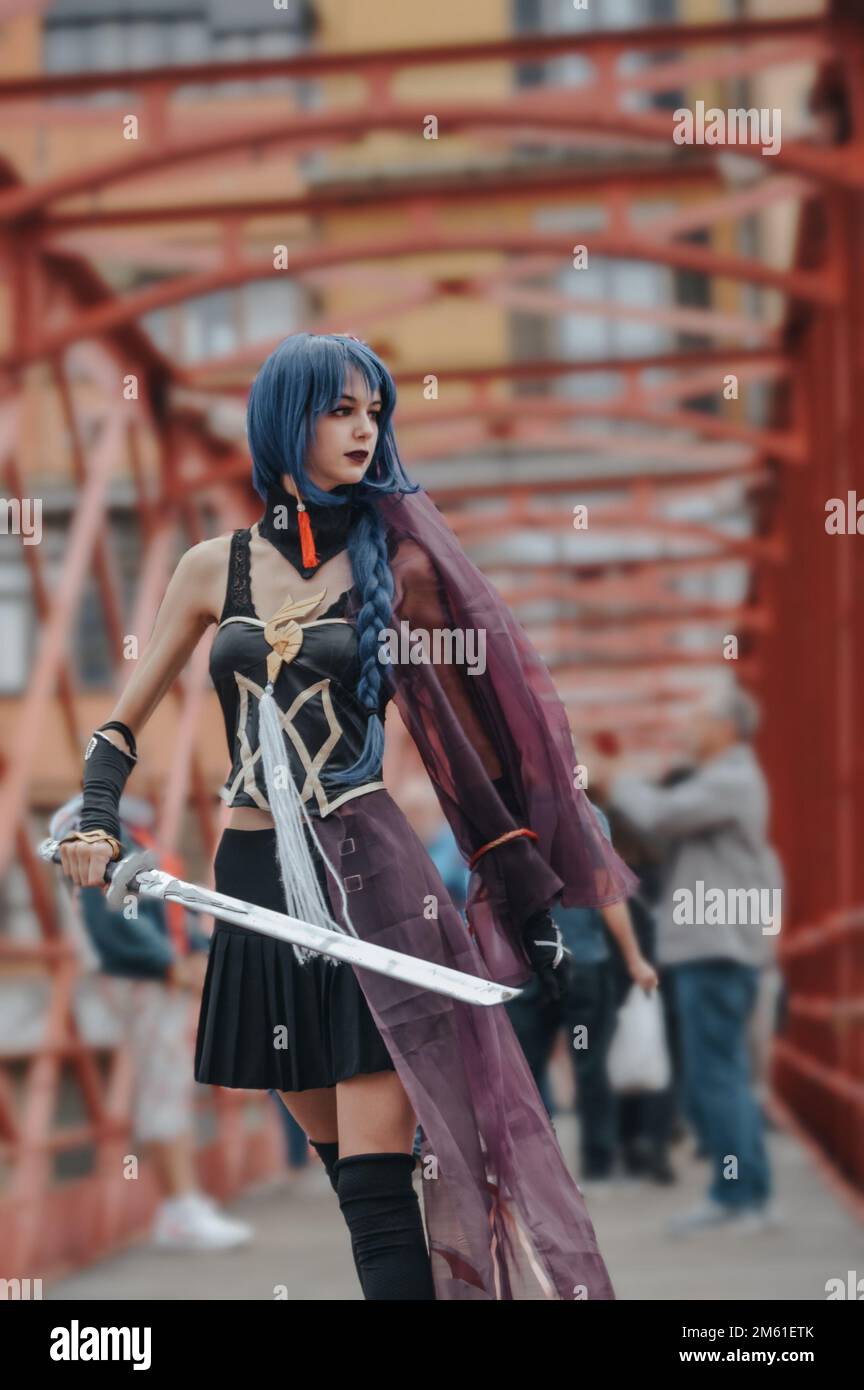 Young girls wearing a black bride like costume, warrior girl wielding a ...