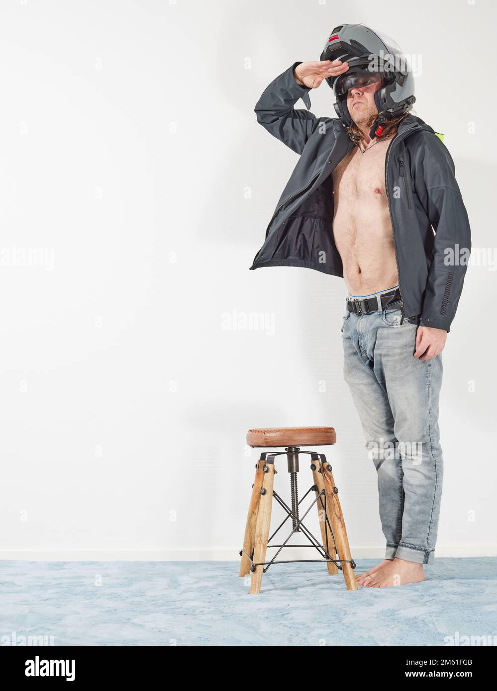 Man waiting for motorcycle season at home Stock Photo - Alamy