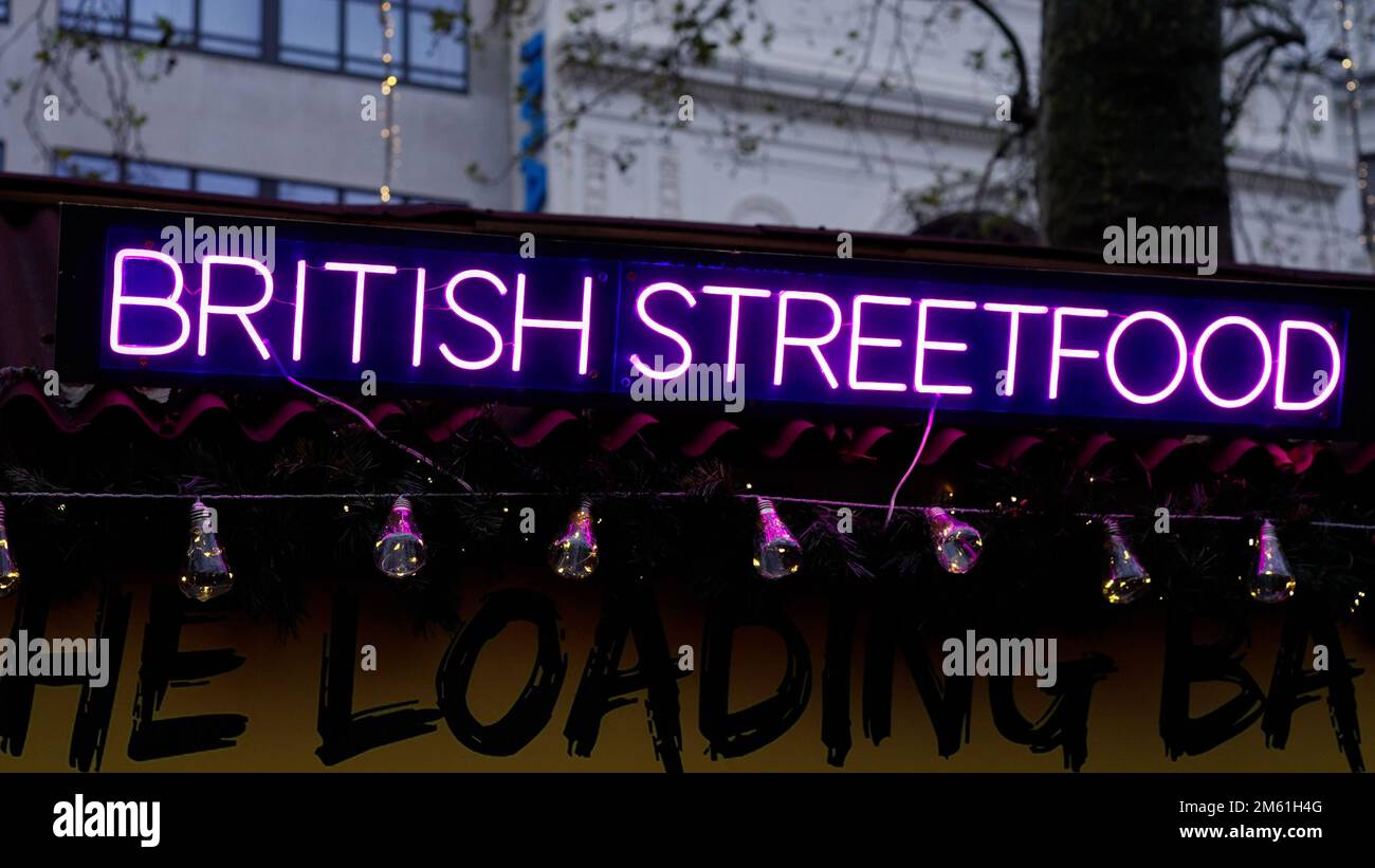 British street food neon sign - LONDON, UK - DECEMBER 20, 2022 Stock ...
