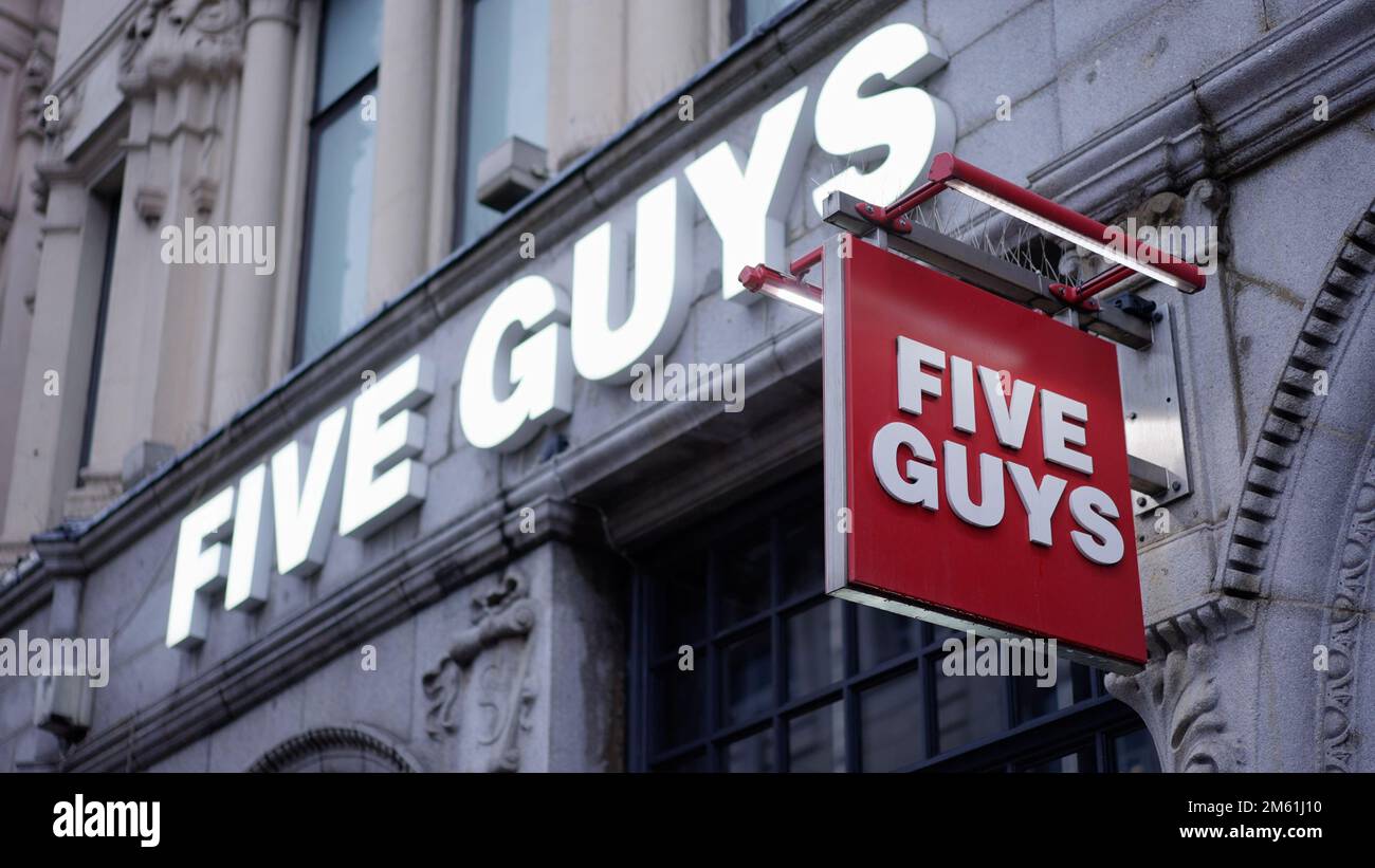 Five Guys burger restaurant in London - LONDON, UK - DECEMBER 20, 2022 ...