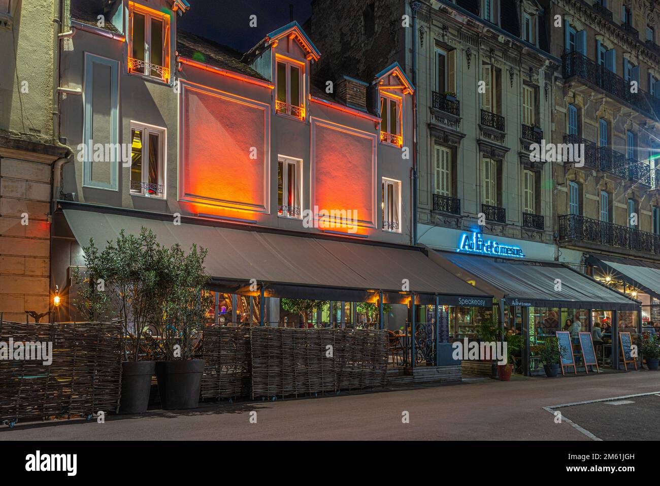 Speakeasy restaurant in Dijon, France at night with light changing ...
