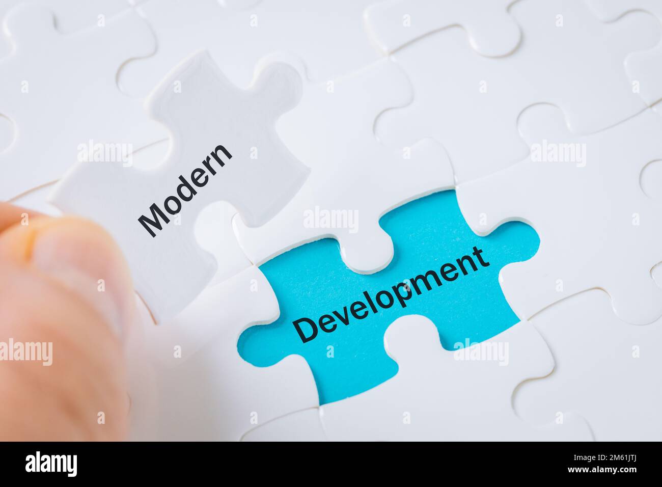 modern development, puzzle revealing text, business concept Stock Photo ...