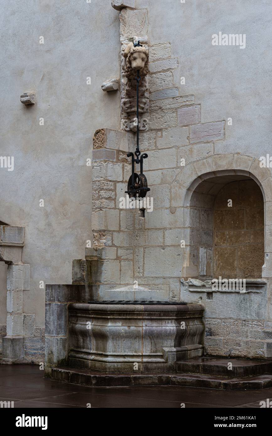 Well with pulley in Dijon France Stock Photo - Alamy