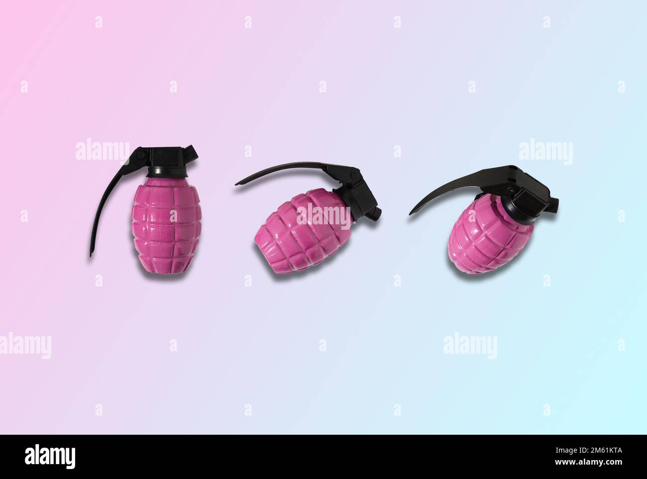 three grenades on a pastel blue-pink background Stock Photo - Alamy