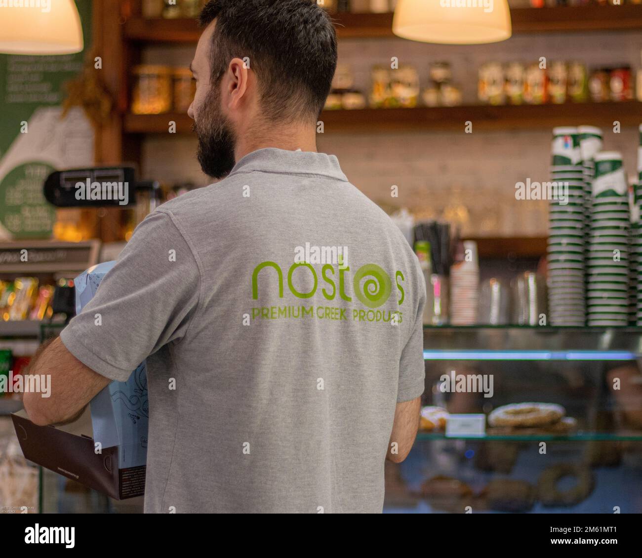 A back of a man working in a coffee shop in Pfungstadt, Germany Stock ...