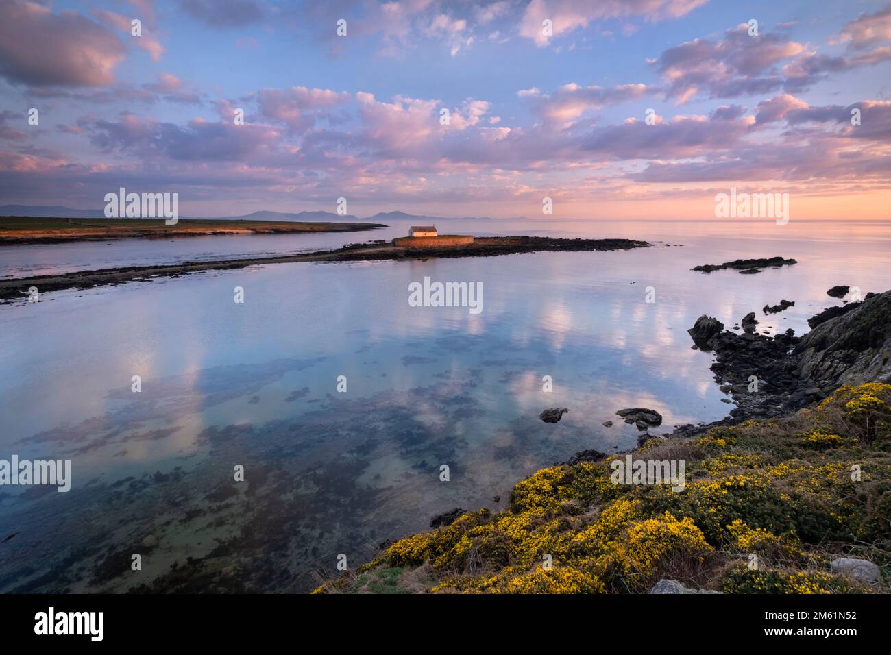 St Cwyfan’s Church on the island of Cribinau backed by the Lleyn ...