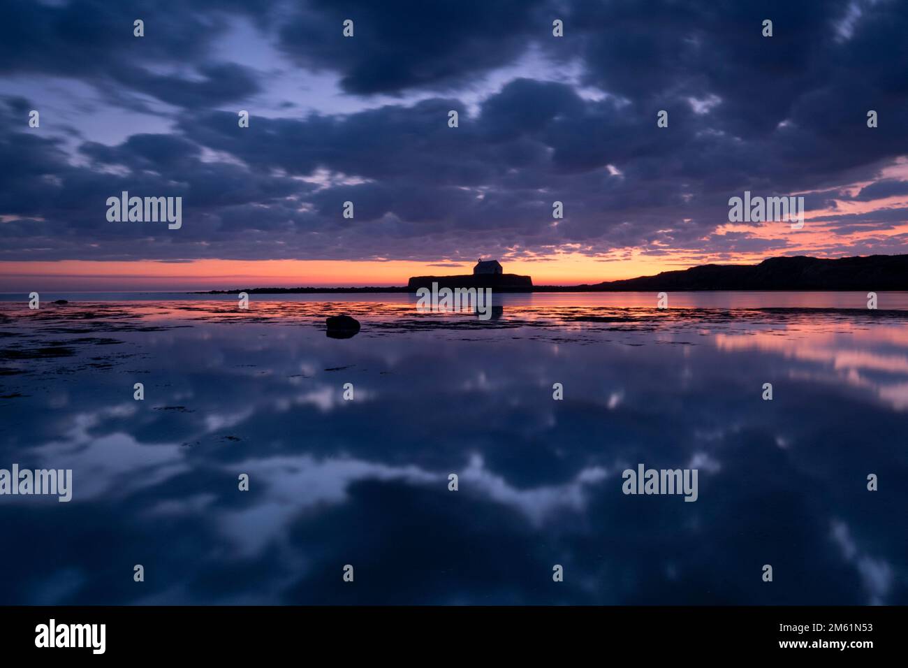 St Cwyfan’s Church on the island of Cribinau at twilight, near ...