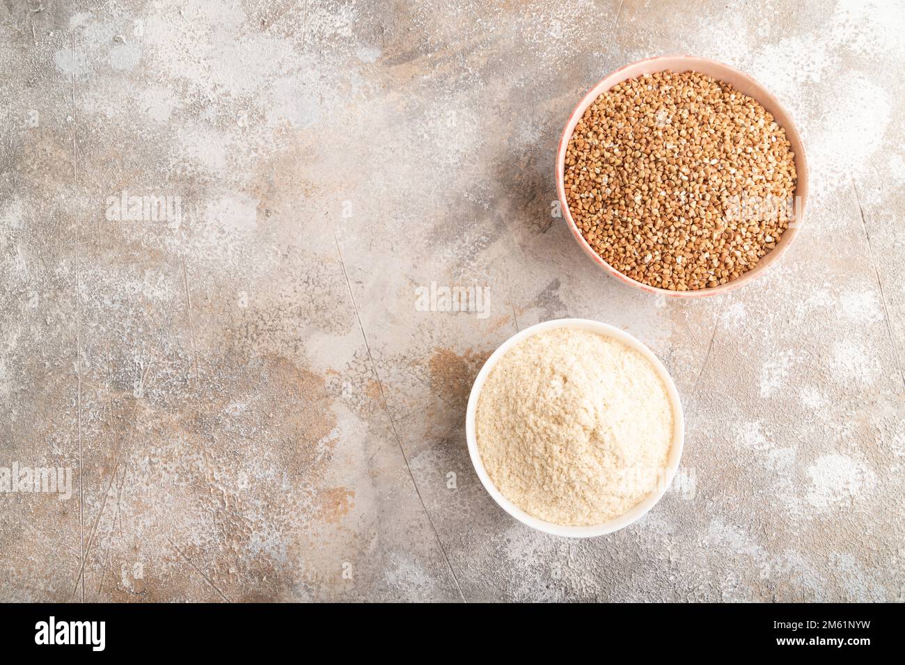 Powdered milk and buckwheat baby food mix, infant formula on brown ...