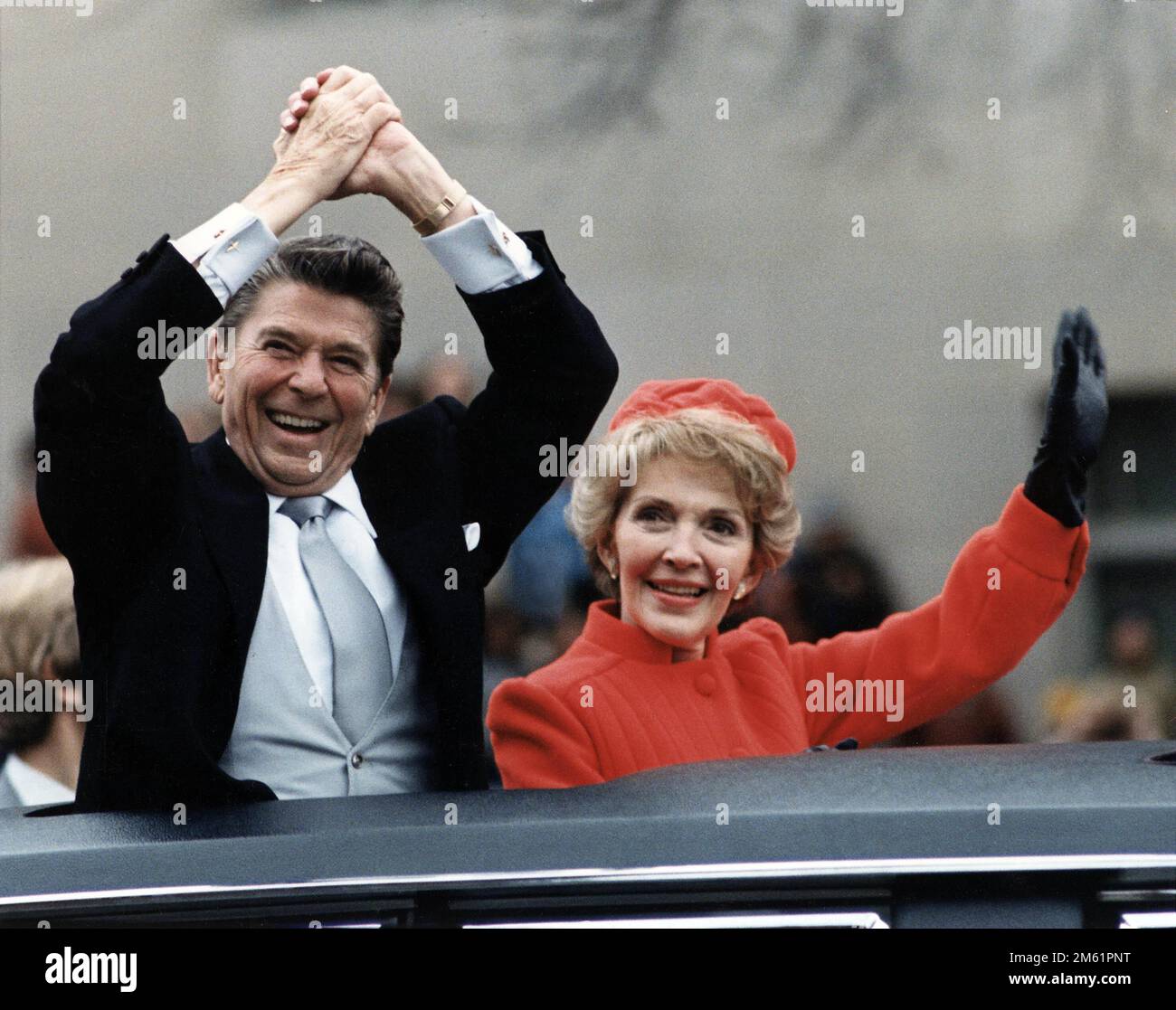 Ronald Reagan and Nancy Reagan waving from the limousine during the ...