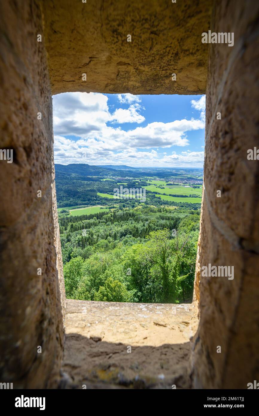 framed view through old stone castle window onto german countryside ...