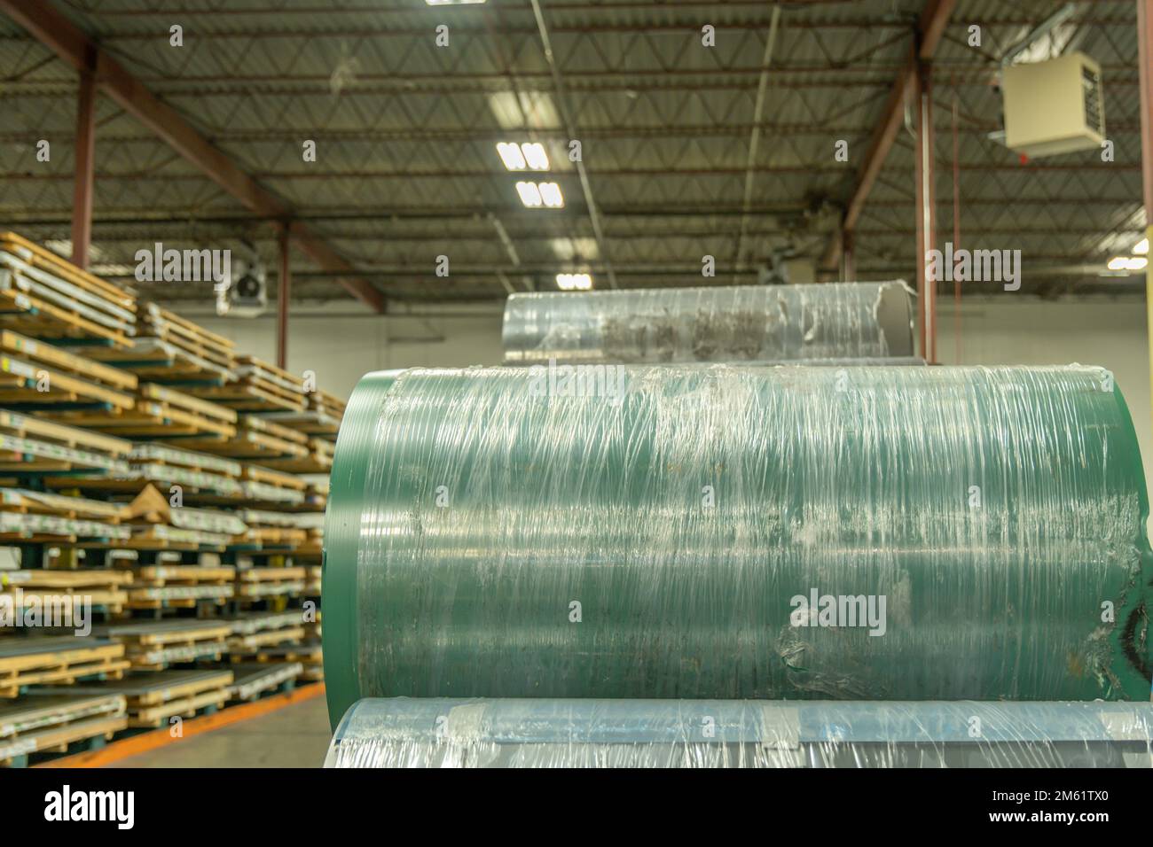 Stacks of steel, metal coil for metal roofing factory Stock Photo - Alamy