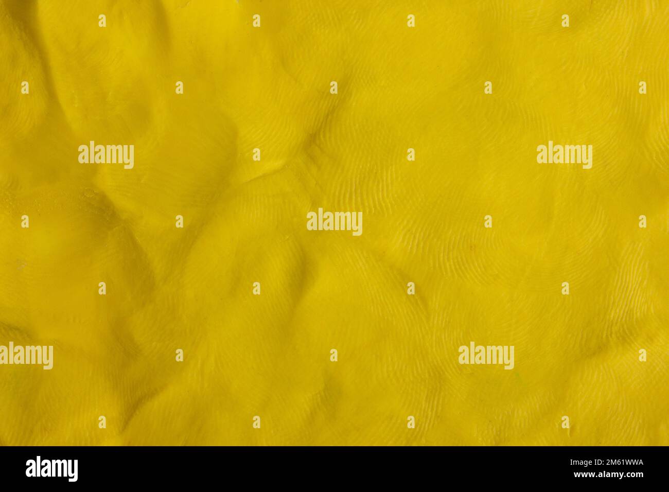 yellow Plasticine textured background Stock Photo - Alamy