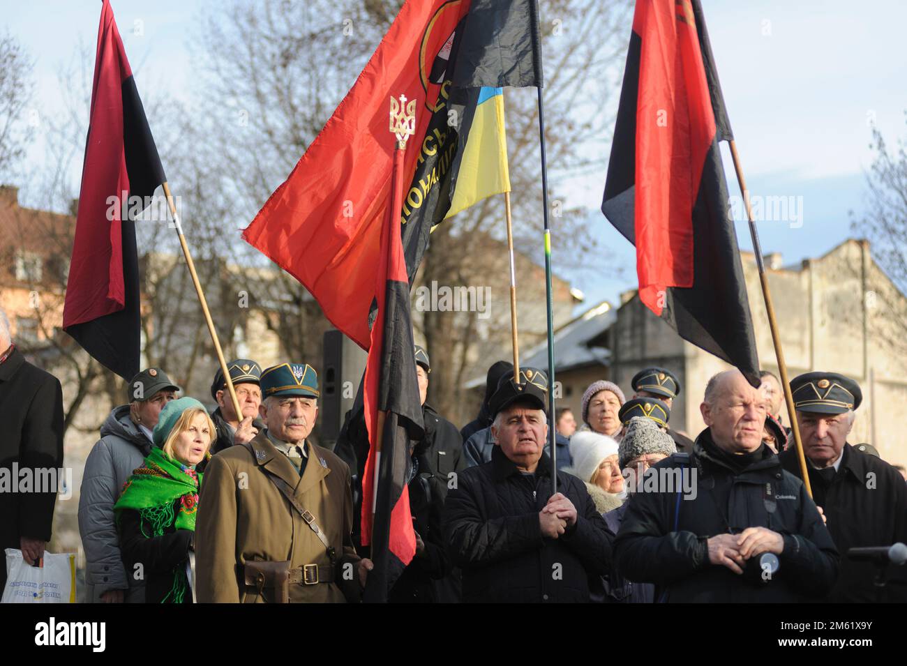 People wearing uniforms of the Ukrainian Insurgent Army and holding ...