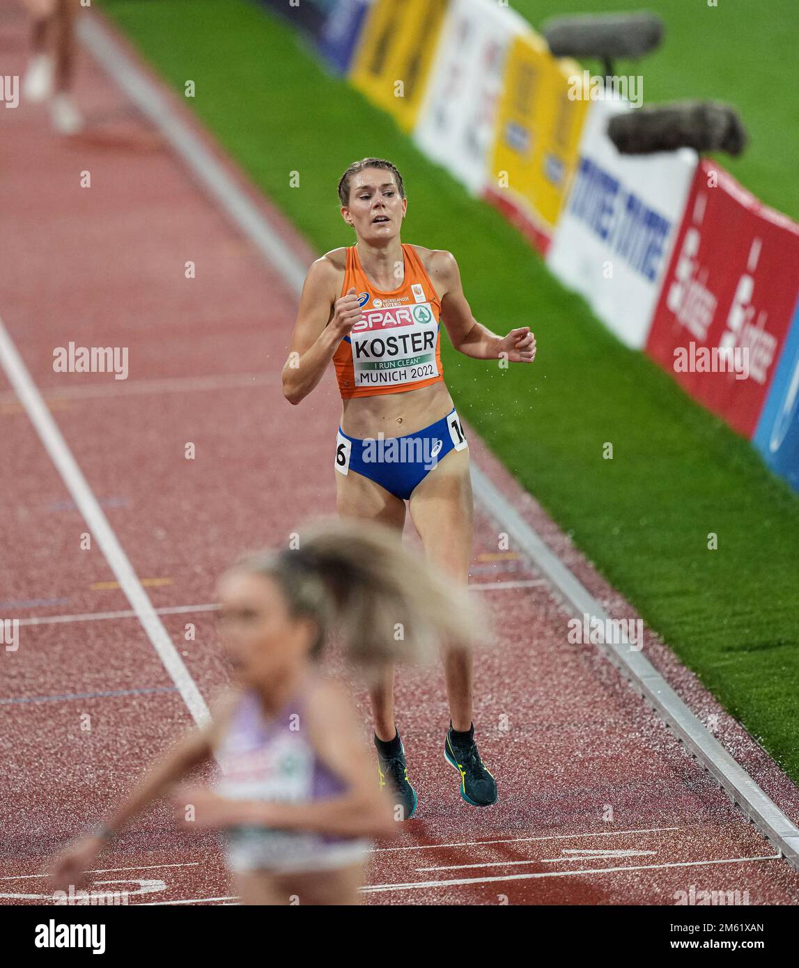 Maureen Koster reaching the finish line in the 5000 meters at the ...