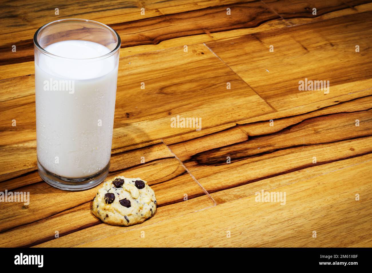 milk and cookie on a wooden background. floor table Stock Photo - Alamy