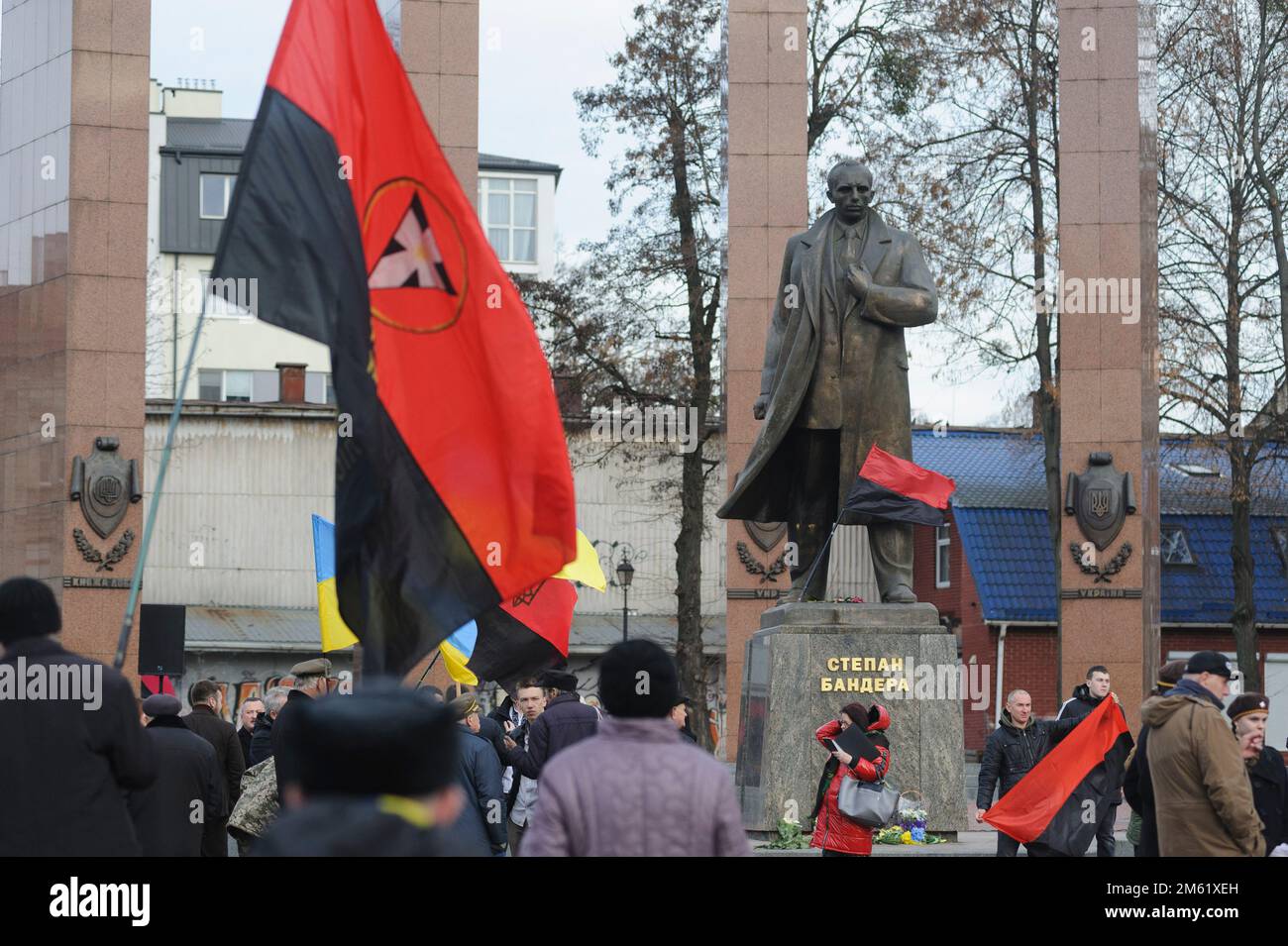 People gather at the monument to the leader of the Organisation of ...