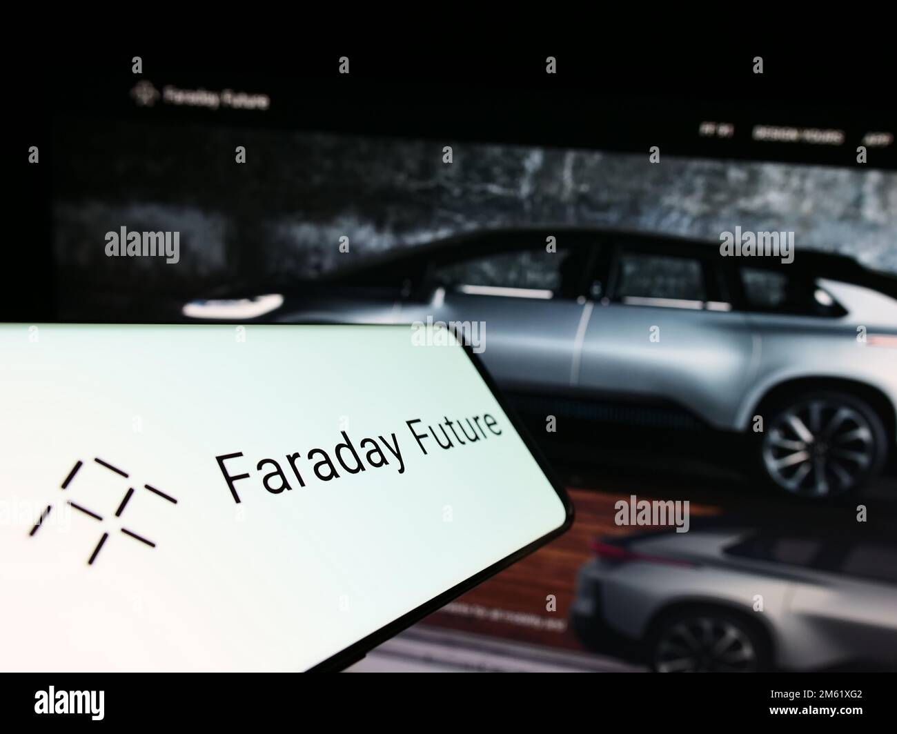 Mobile phone with logo of electric vehicle company Faraday Future Inc ...