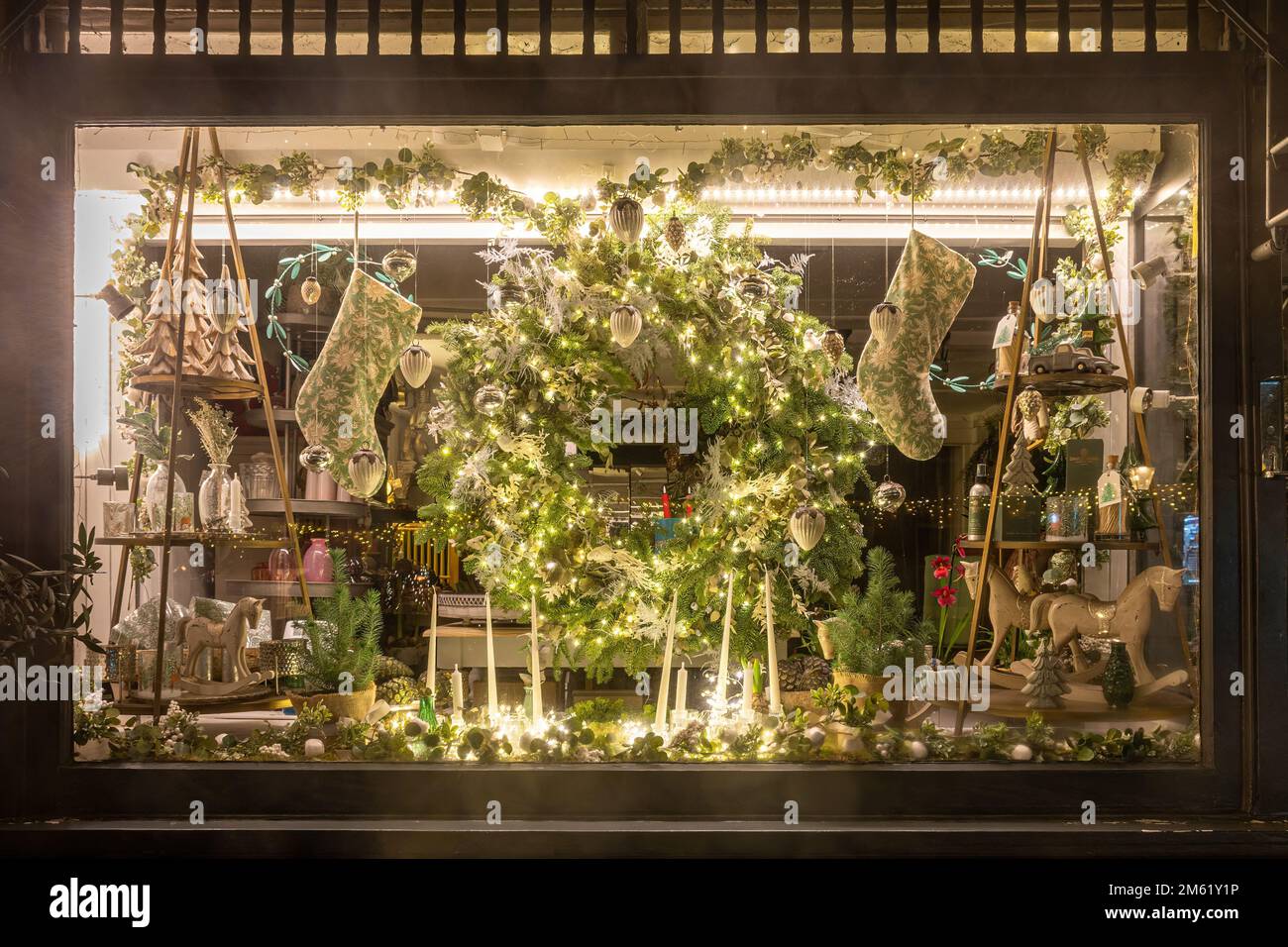 Christmas display in a shop window, with Christmas wreath, decorations ...