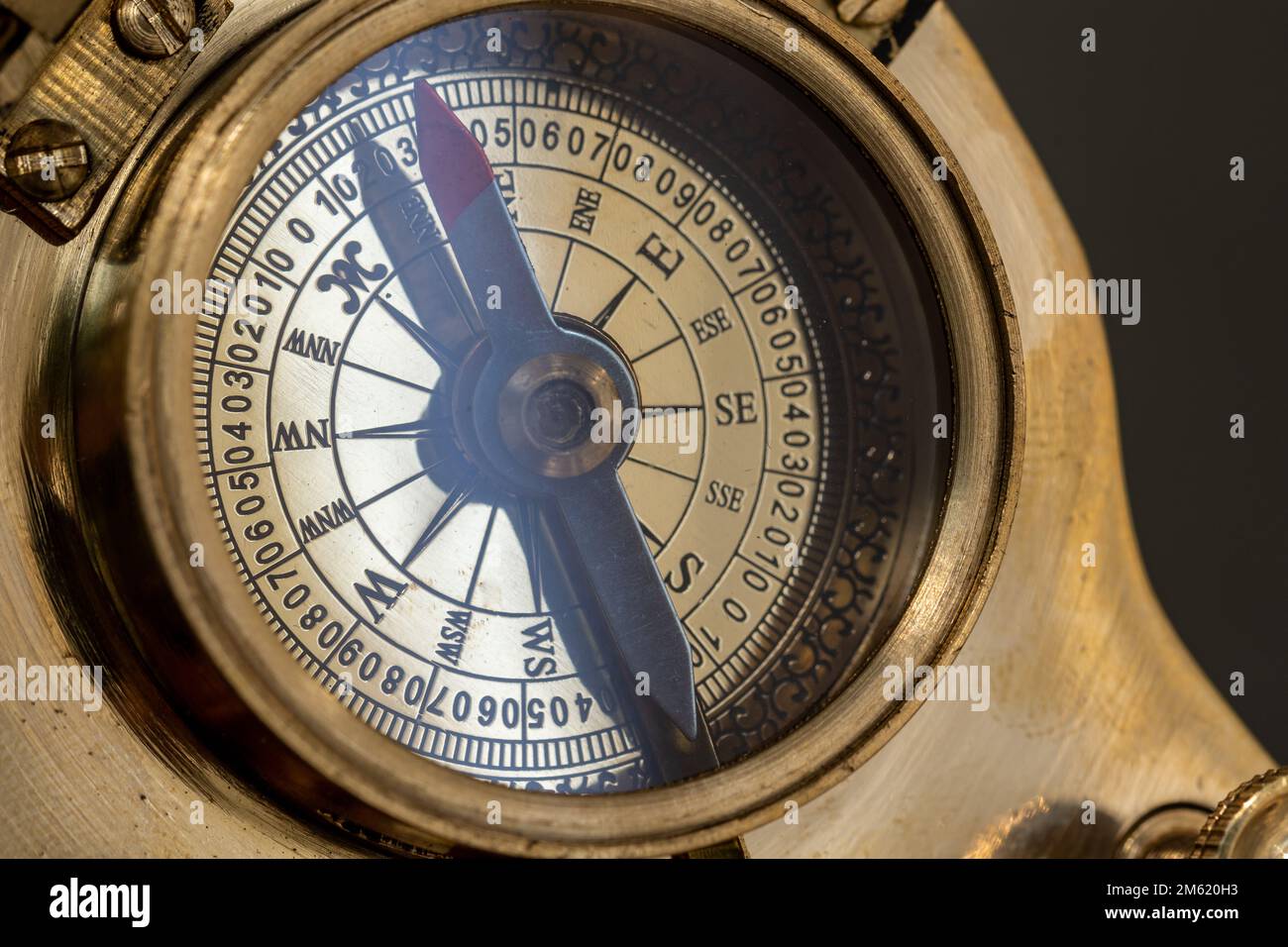 Detail of an antique maritime bronze solar compass Stock Photo - Alamy