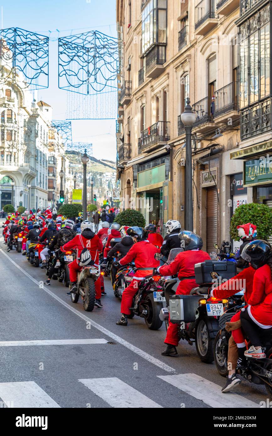 Granada, Spain; December-18, 2022: People dressed as Santa Claus ...