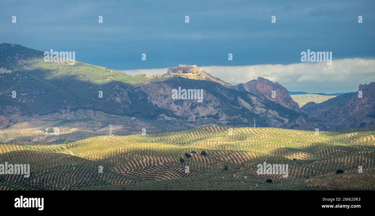 Distant view of the Granada town of Moclín (Spain) on top of a rock on ...