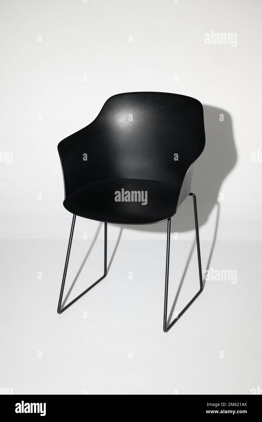 Elegant black chair on a white background in a photo studio, a chair ...